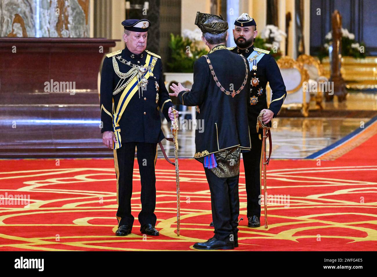 King of Malaysia Sultan Ibrahim Iskandar, left, speaks with Crown ...