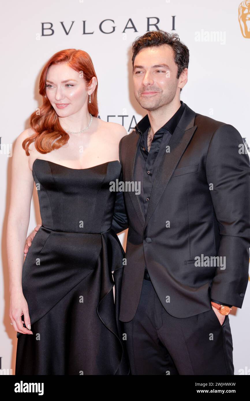 Eleanor Thompson, left, and Aidan Turner pose for photographers upon ...