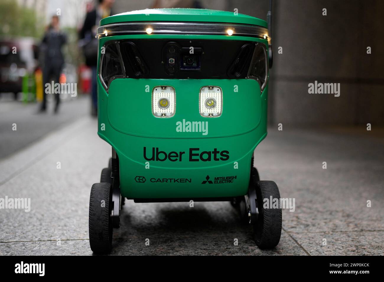 An Uber Eats food delivery robot is seen during its demonstration for ...