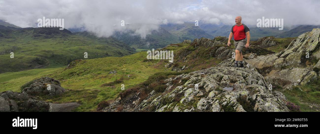 Walker at the Summit Cairn of Grange Fell on the Watendlath Fells, Lake ...