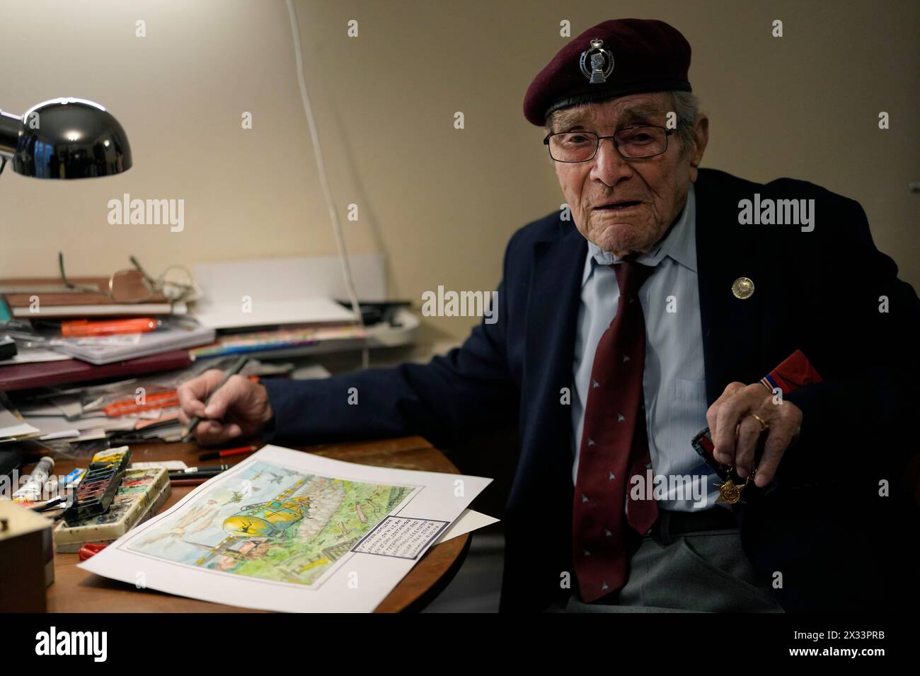 FILE - D-Day veteran Bill Gladden shows off one of his paintings, that ...