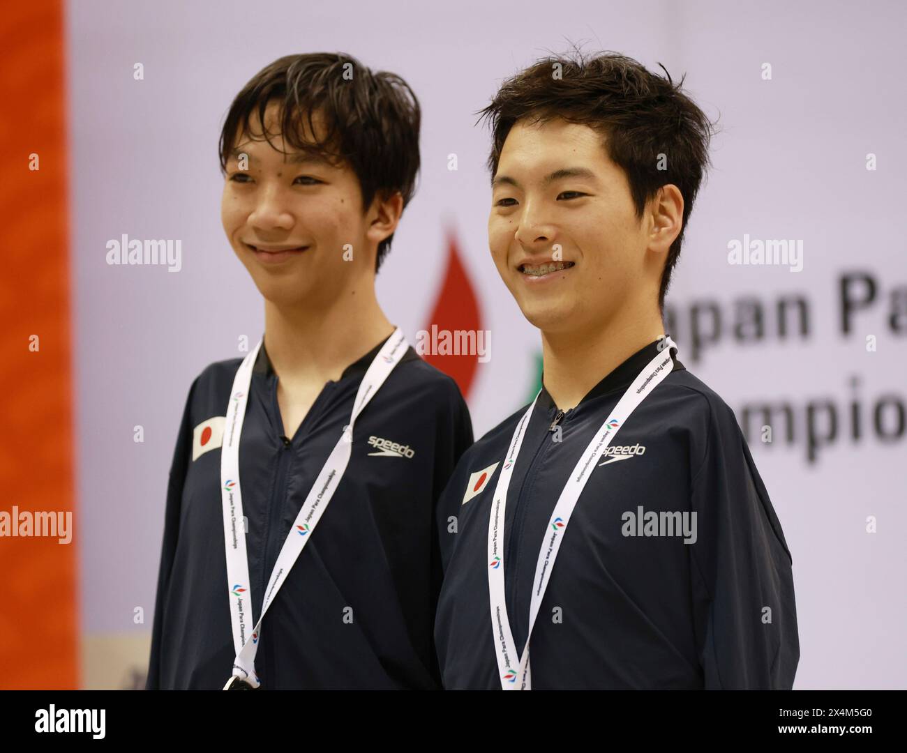 HINATA Kaede (R) and TANAKA Eigo smiles on the podium of the 100-meter ...
