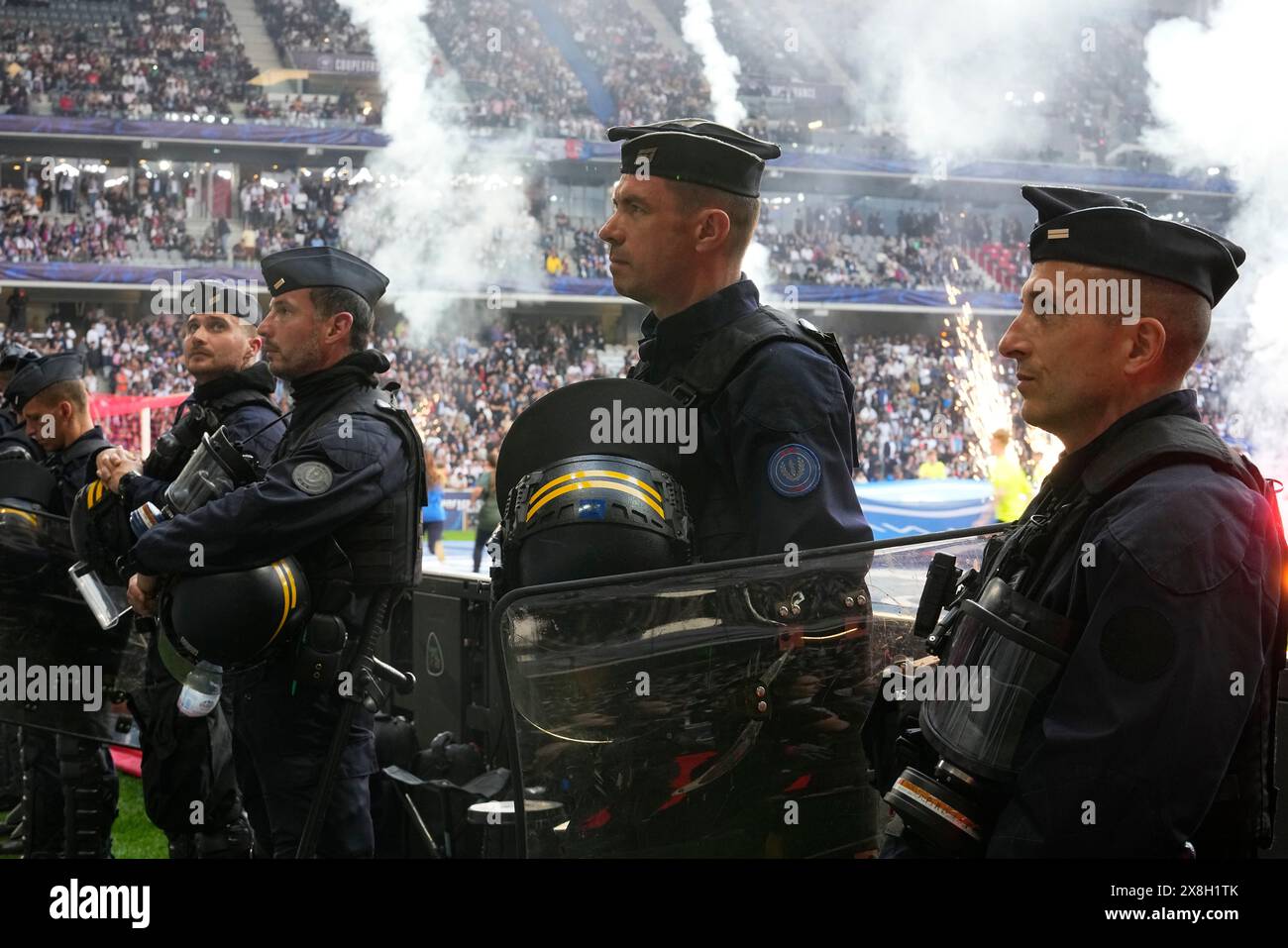 French riot police officers stand on the side of the pitch before the ...
