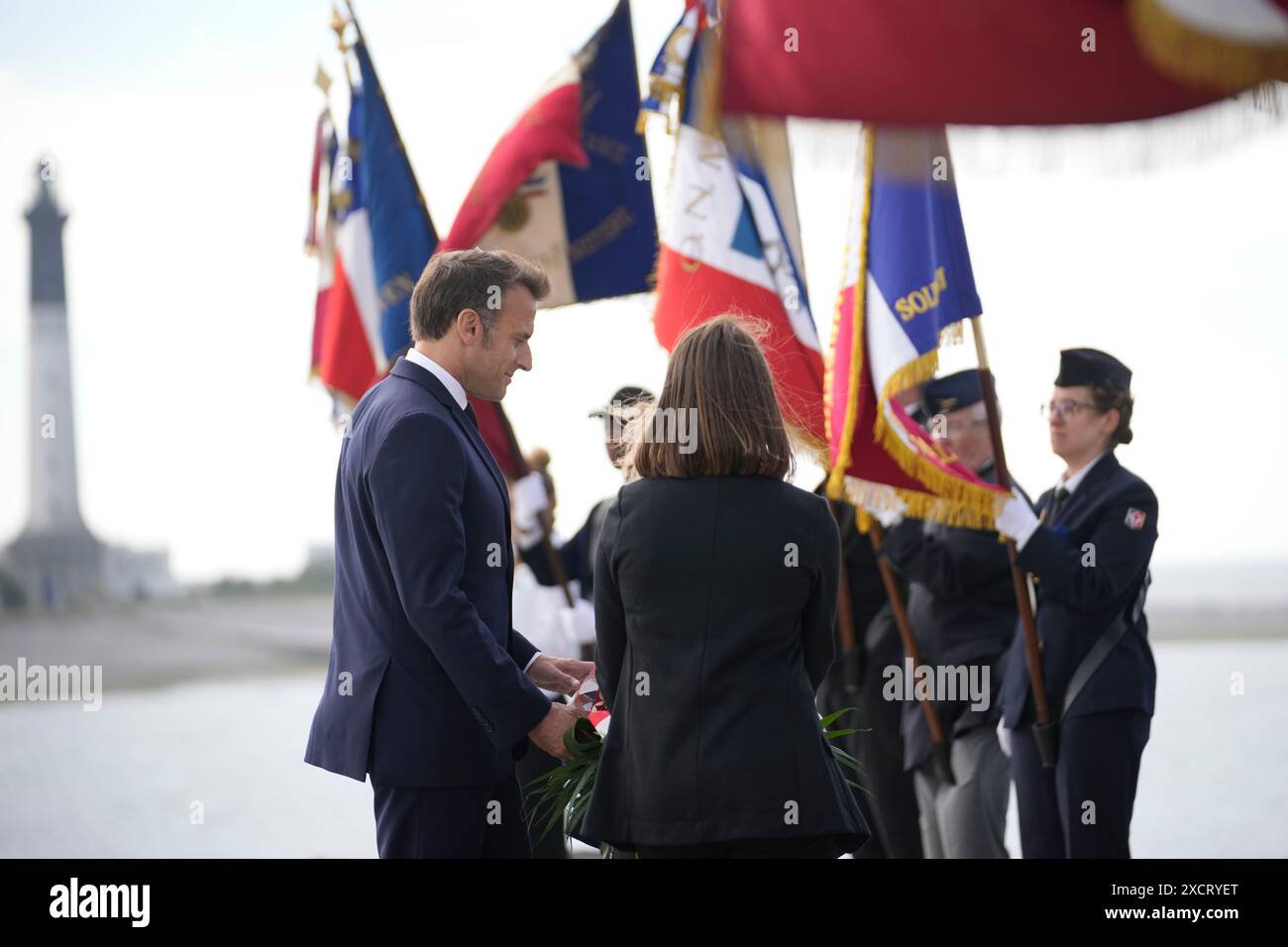 French President Emmanuel Macron lays a wreath of flowers at the Croix ...