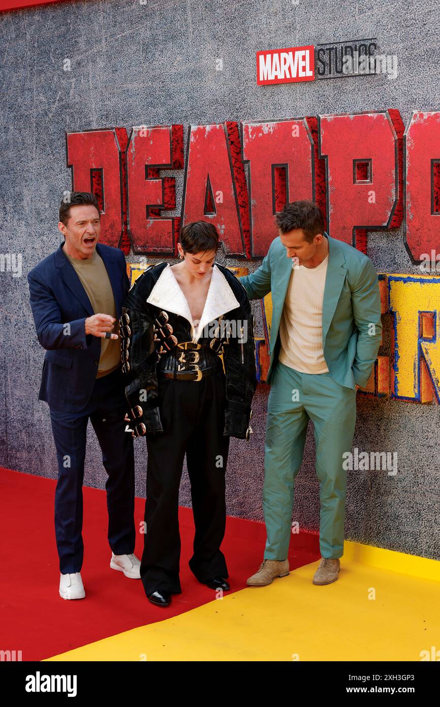 Ryan Reynolds, from left, Hugh Jackman, and Emma Corrin pose for ...