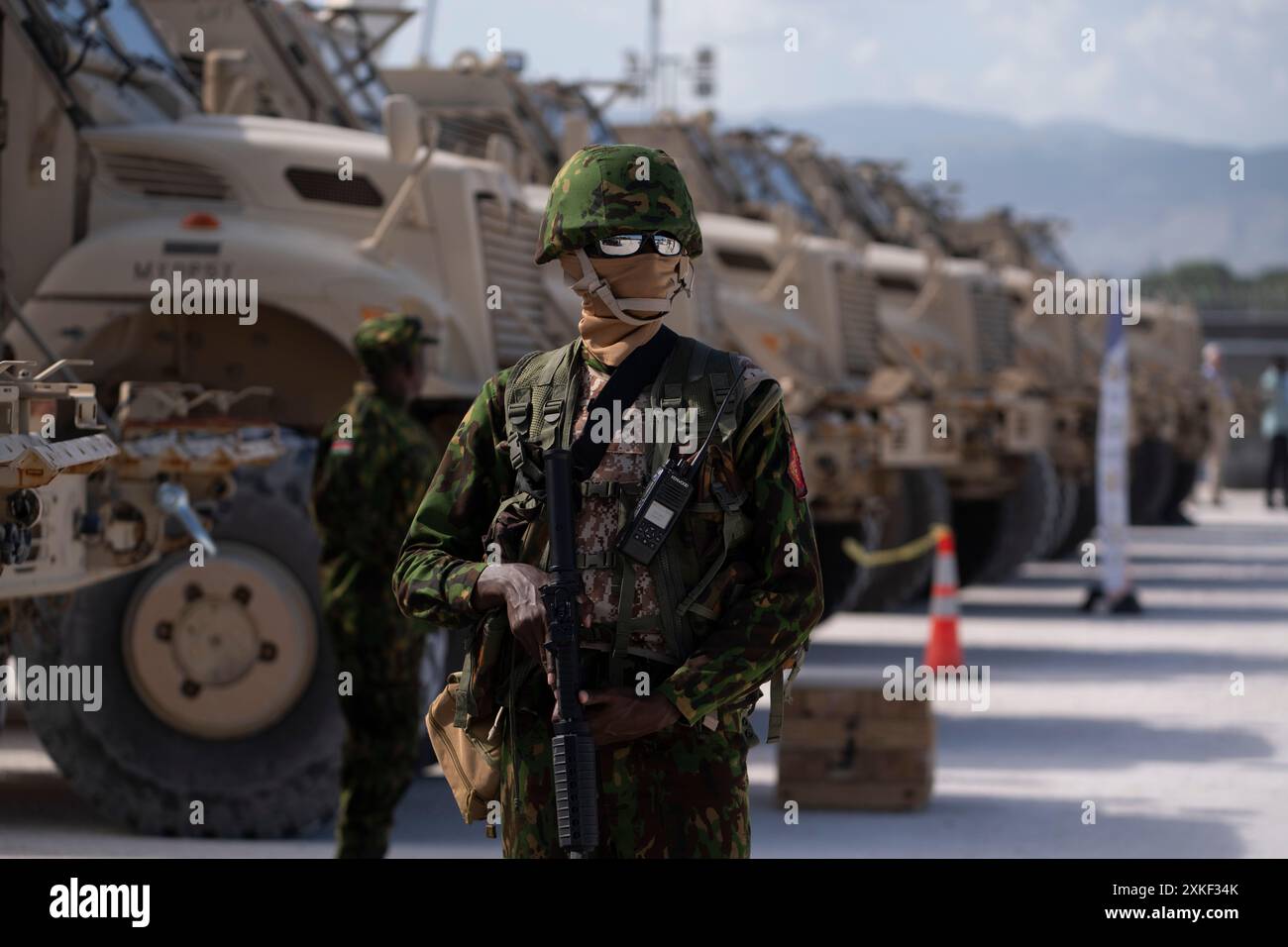 A Kenyan police officer part of a UN-backed multinational force stands ...