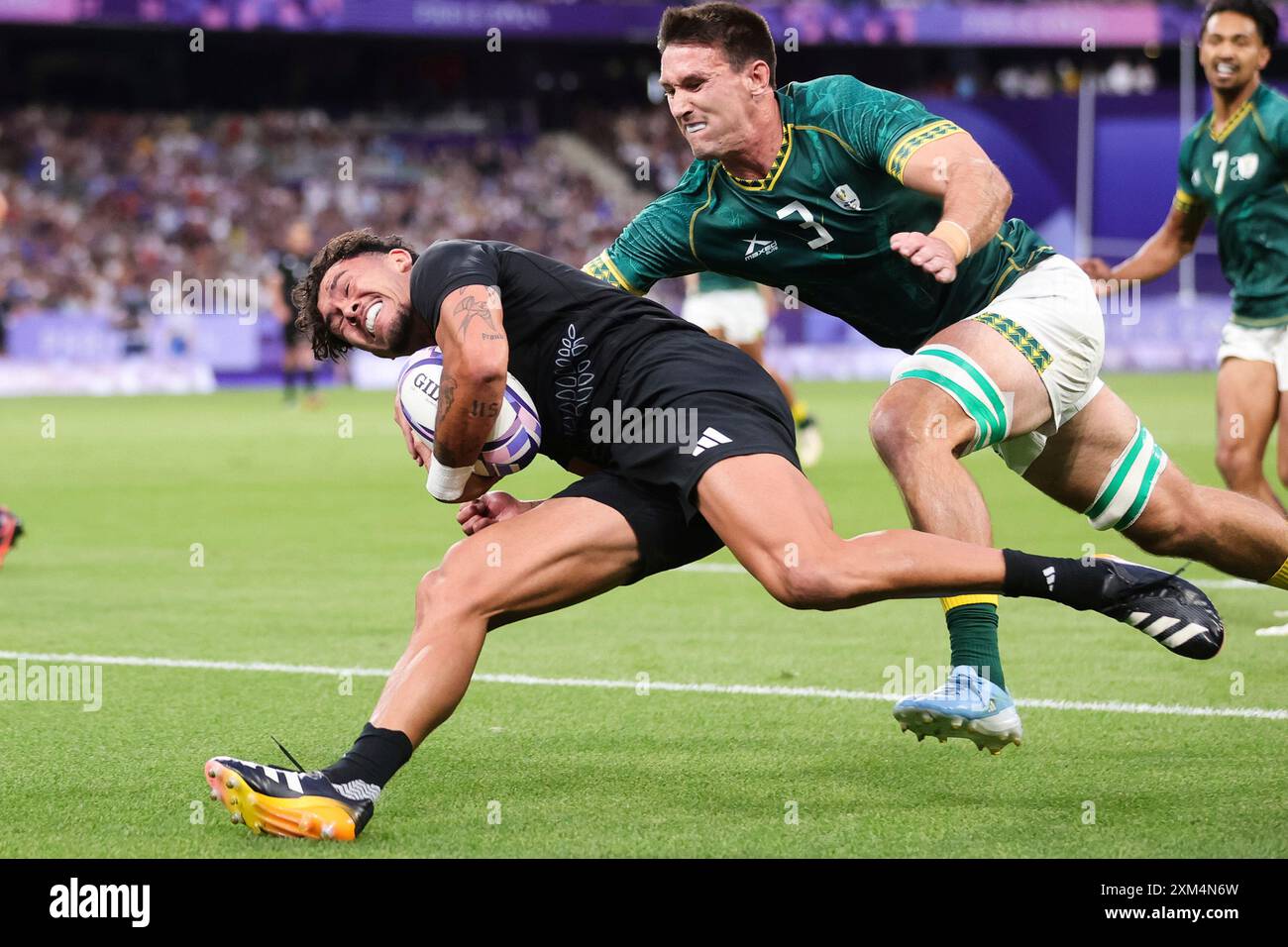PARIS, FRANCE - JULY 25: Moses Leo (11) of Team New Zealand scores a ...