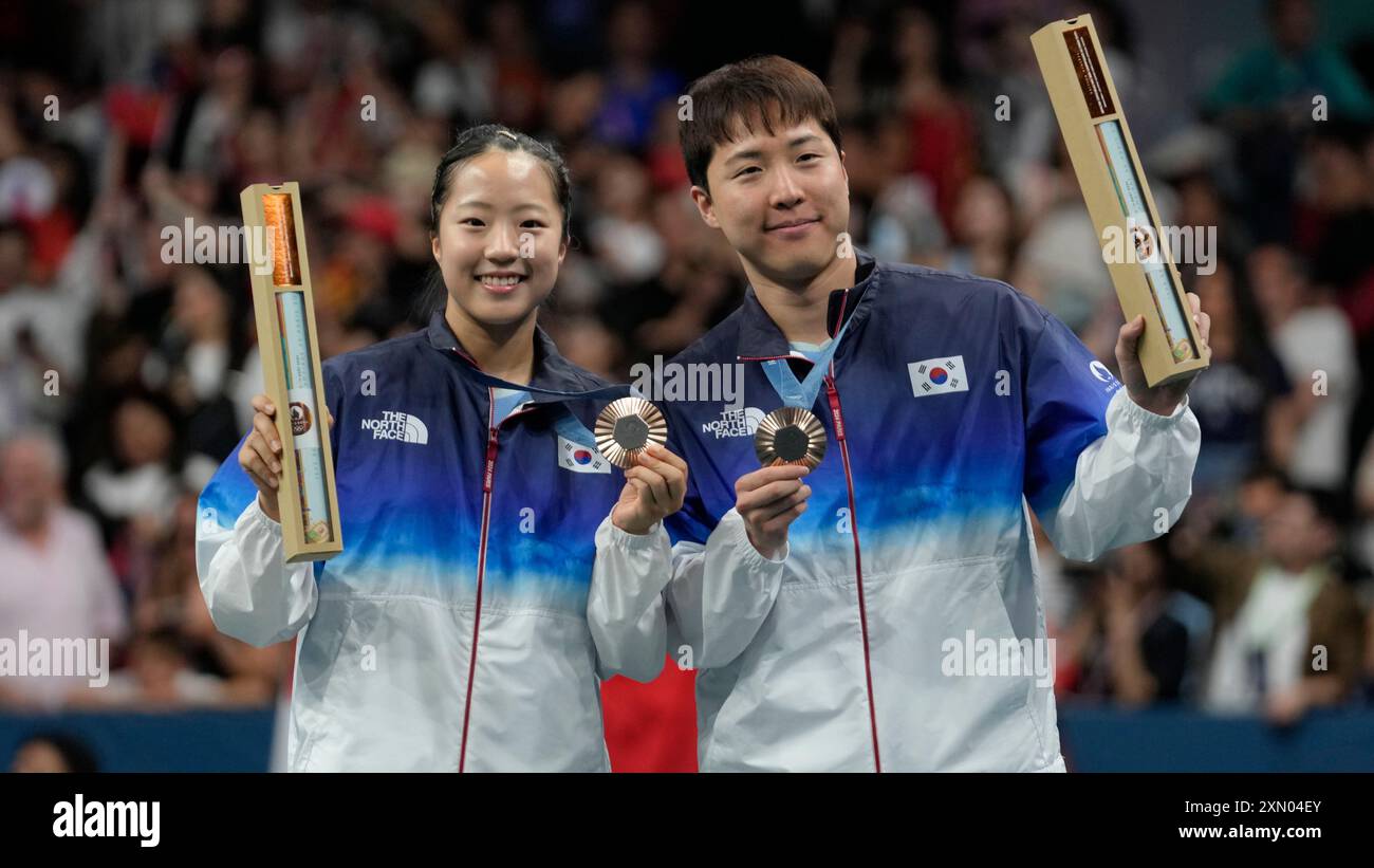 South Korea's Shin Yubin, left, and Lim Jonghoon pose with their bronze ...