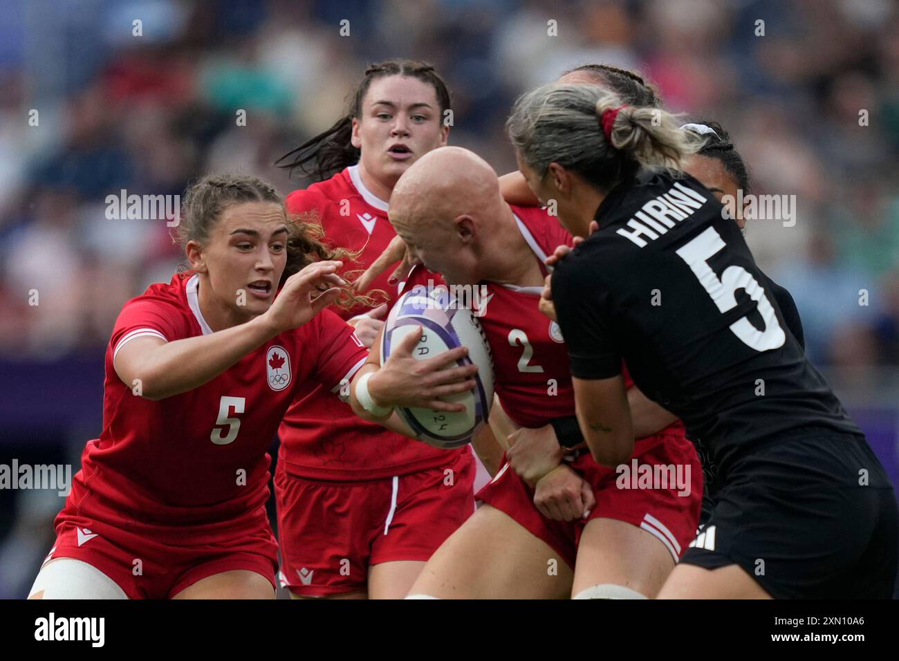 Canada's Olivia Apps, centre gets the back to Canada's Chloe Daniels as ...
