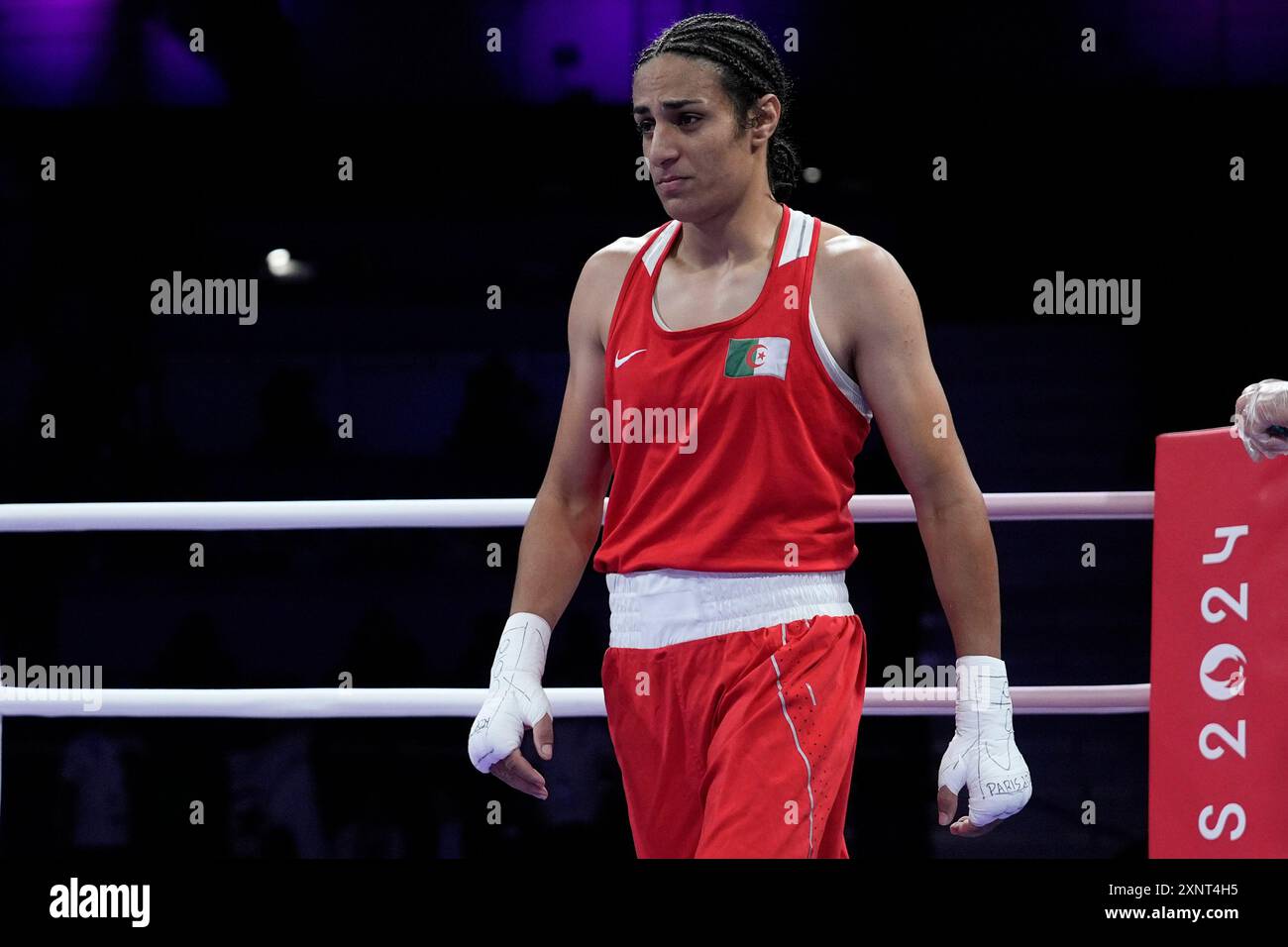 Algeria's Imane Khelif walks in the ring after fighting Italy's Angela ...