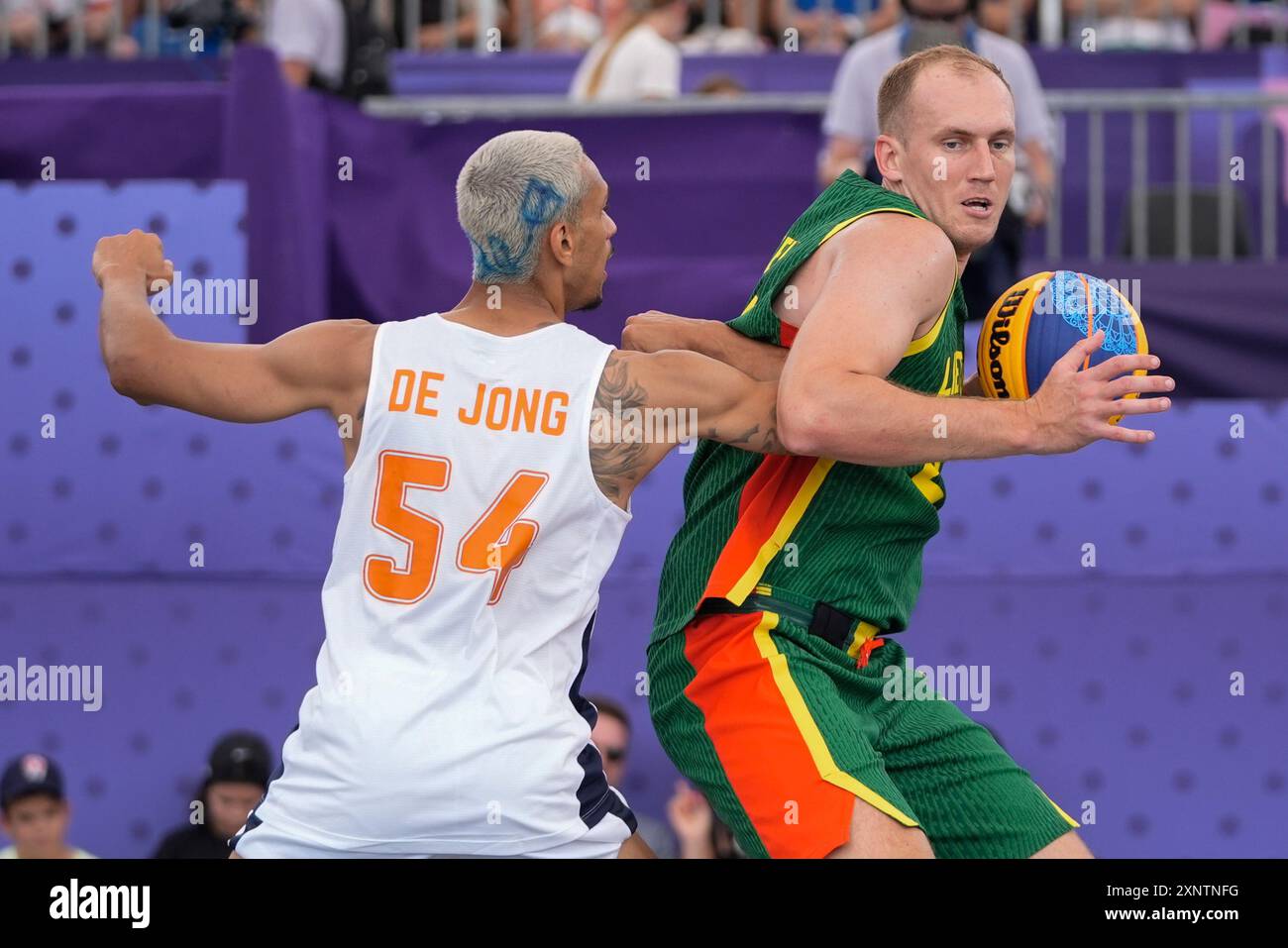 Lithuania's Aurelijus Pukelis, right, protects the ball from Worthy de ...