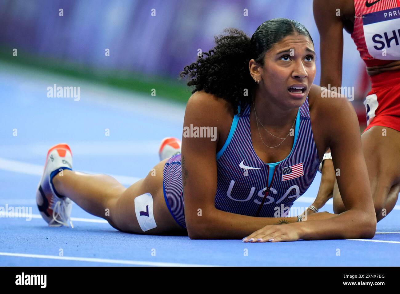 Juliette Whittaker, of the United States, falls after a heat in the ...