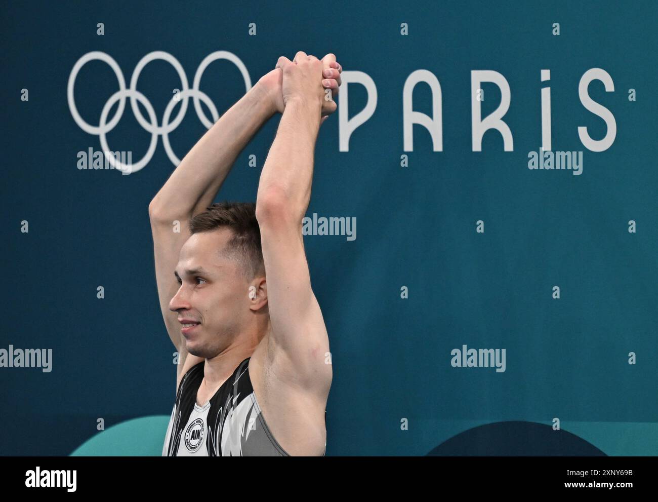 LITVINOVICH Ivan of Individual Neutral Athletes reacts after performing ...