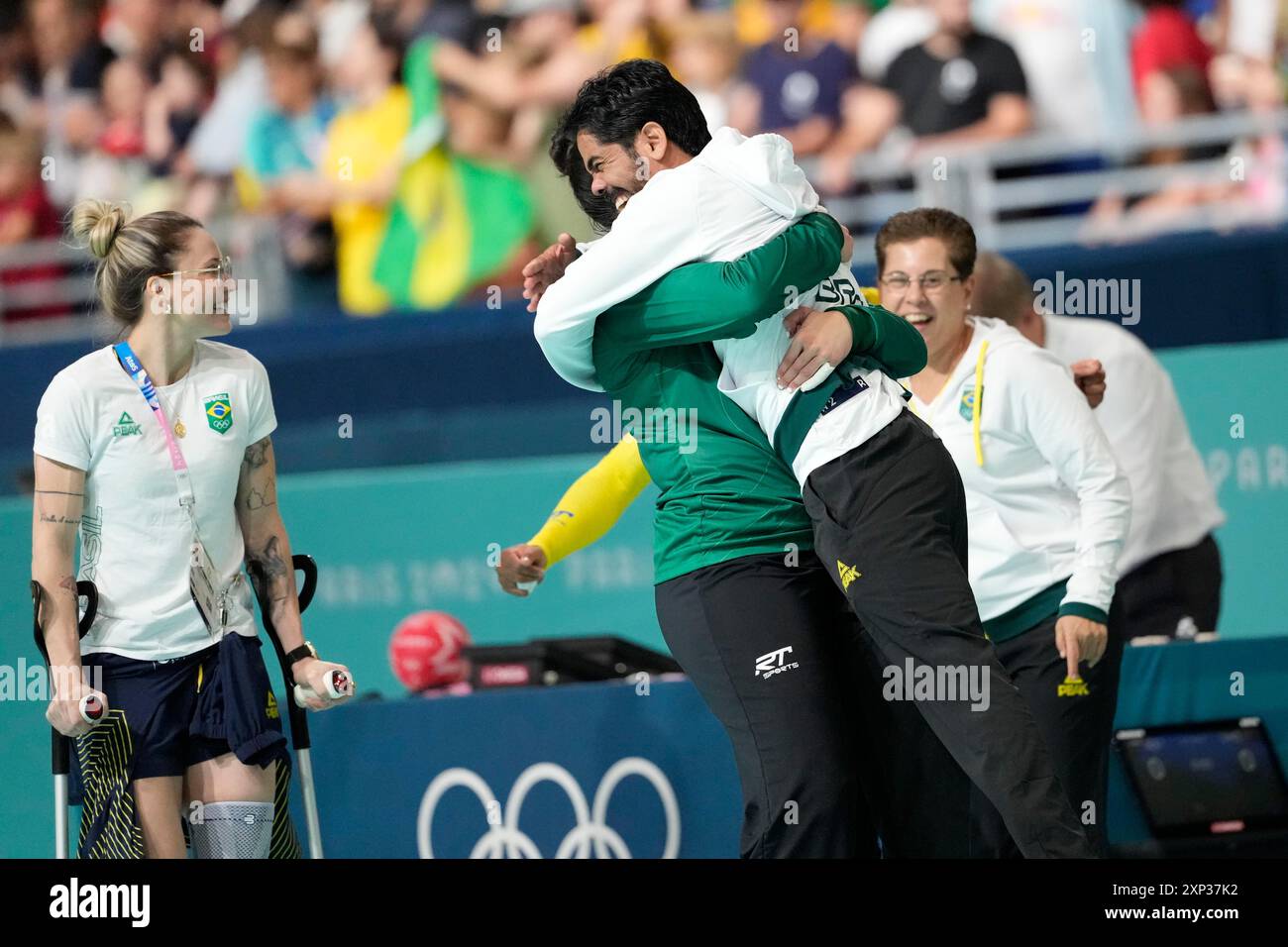 Members of the Brazil team celebrate after winning against Angola ...