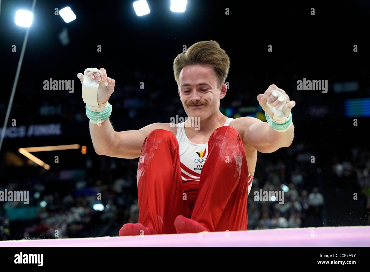 Glen Cuyle, of Belgium, reacts after tumbling on his landing while ...