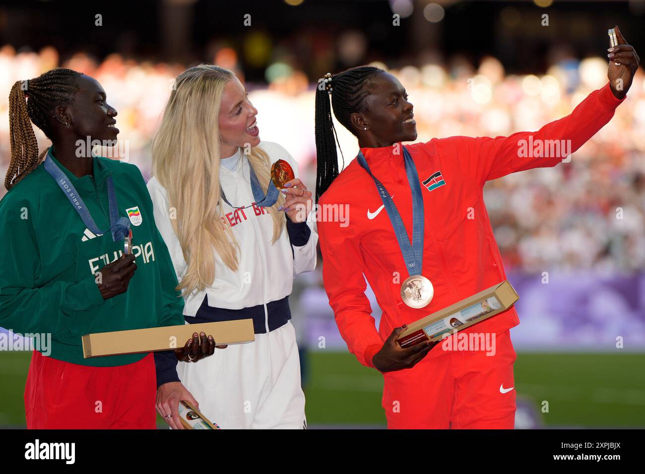 Silver medalist Tsige Duguma, of Ethiopia, from left, gold medalist ...
