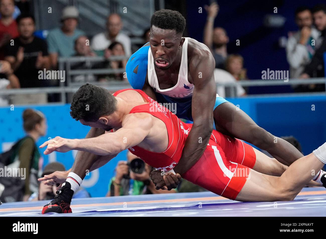 Tunis' Souleymen Nasr and France's Mamadassa Sylla compete in the round ...