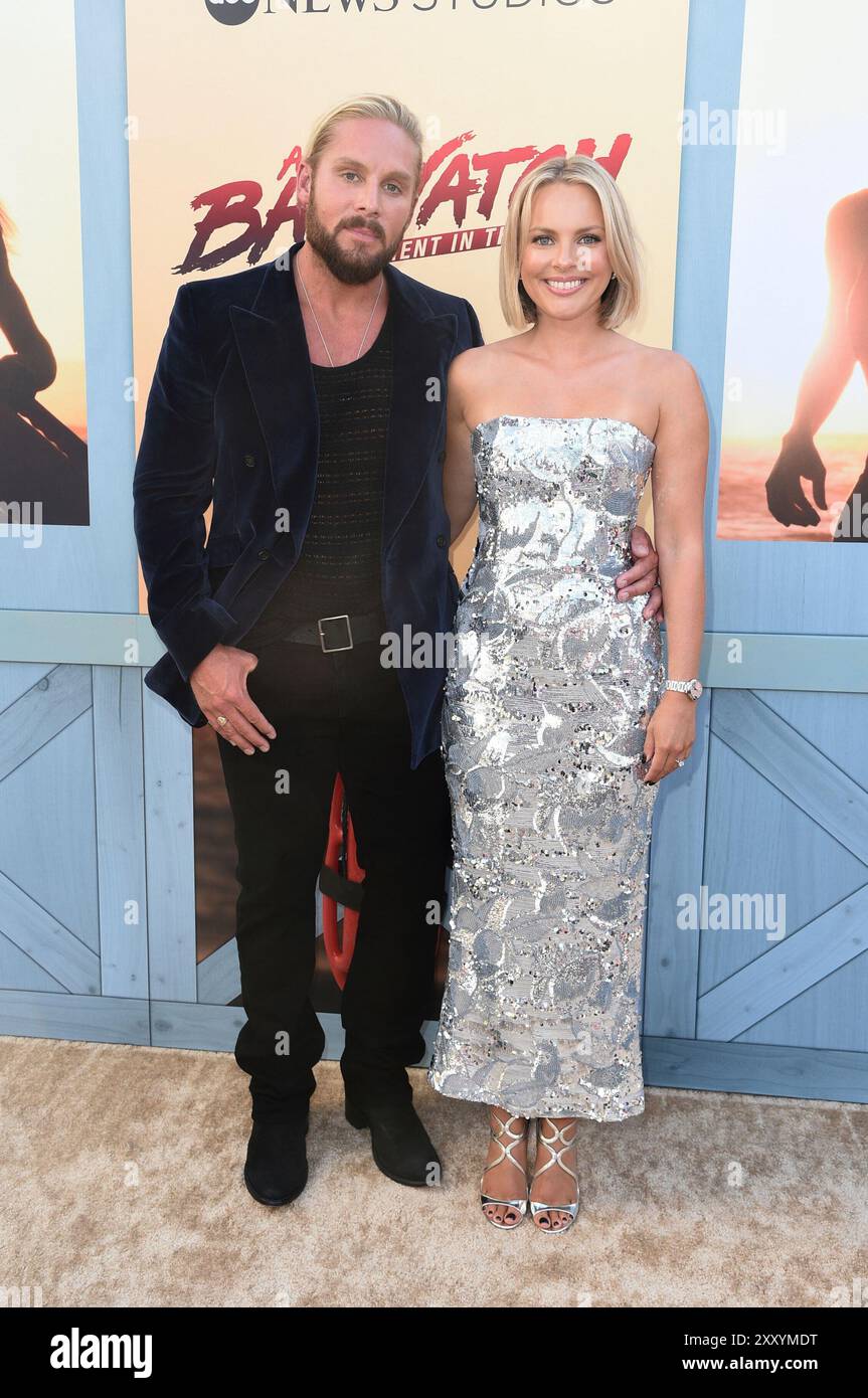 Matthew Felker, left, and Elizabeth Felker arrive at the premiere of ...