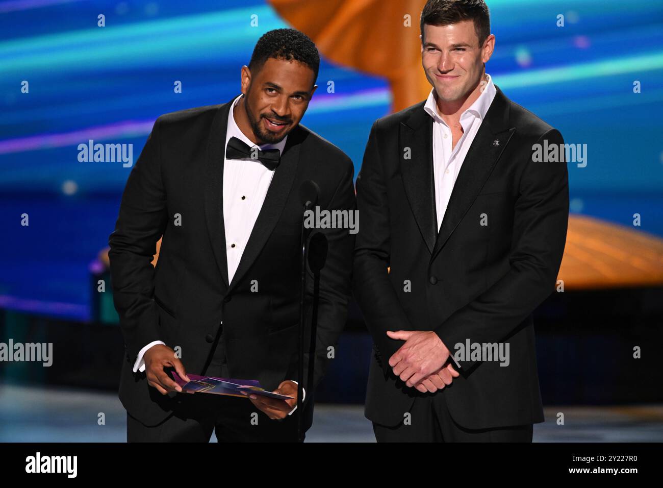 Damon Wayans Jr., from left, and Austin Stowell present the Emmy for ...