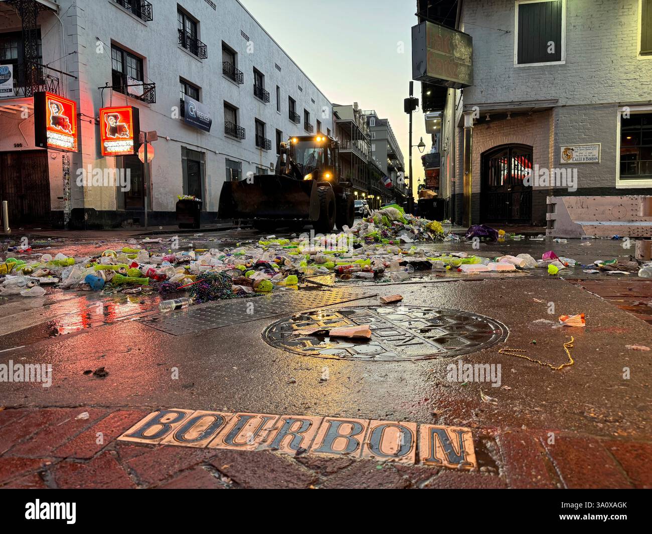 Waste from Mardi Gras scattered across infamous party spot Bourbon Street in New Orleans, on Ash ...