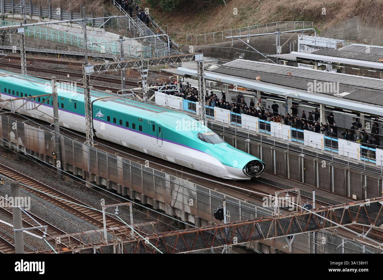 A photo shows "Hayabusa" of the Tohoku Shinkansen (bullet train) moving with its coupling ...