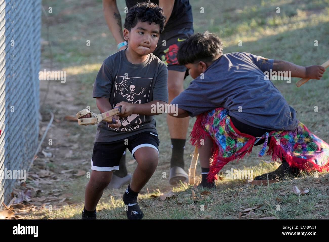 Choctaw children are initiated into the sport of stickball at an early ...