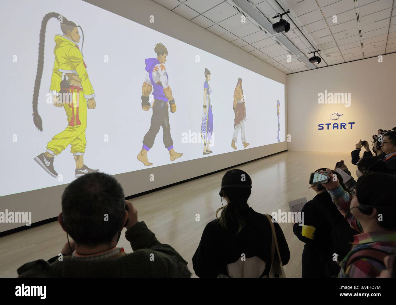 Attendees tour the preview of "Capcom Creation –moving hearts across ...