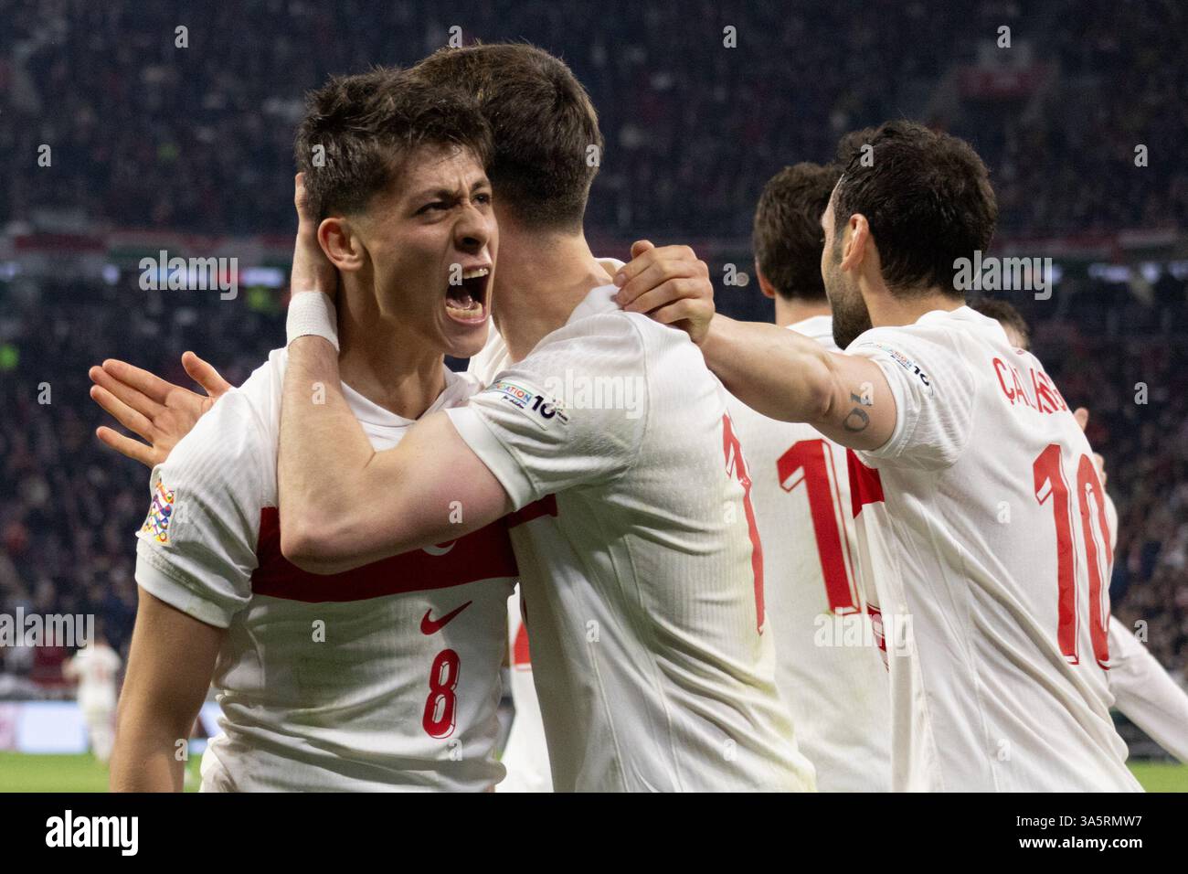 Budapest. März 2025. Arda Guler (L) von T¨¹rkiye feiert mit seinen ...