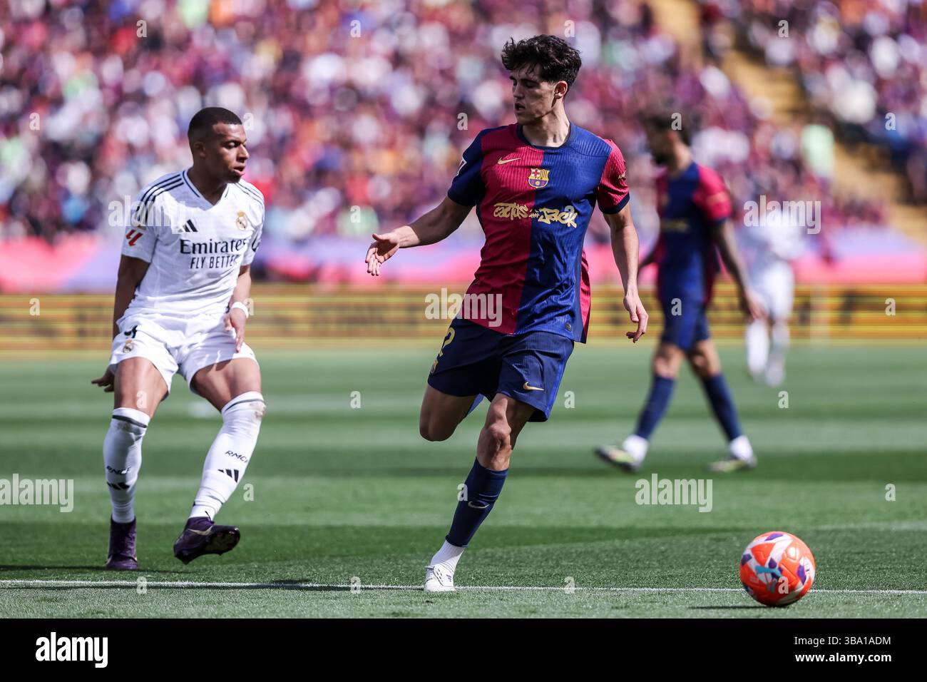 Pau Cubarsi of FC Barcelona and Kylian Mbappe of Real Madrid in action ...