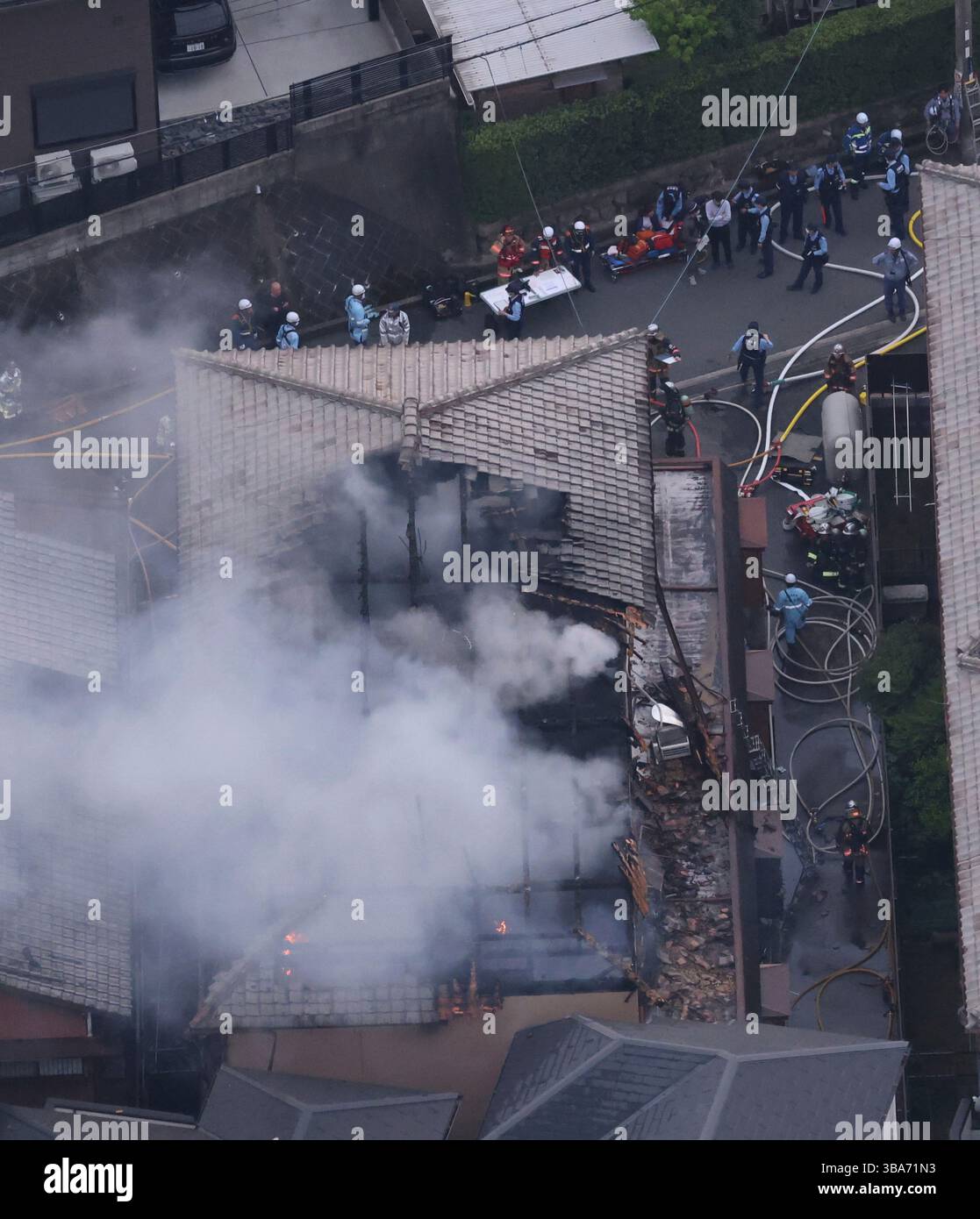 An aerial photo shows the scene of a house fire, where a teenage man ...