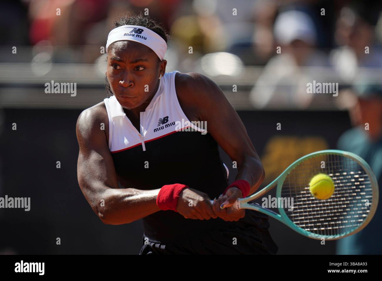 United States' Coco Gauff returns the ball to Britain's Emma Raducanu ...
