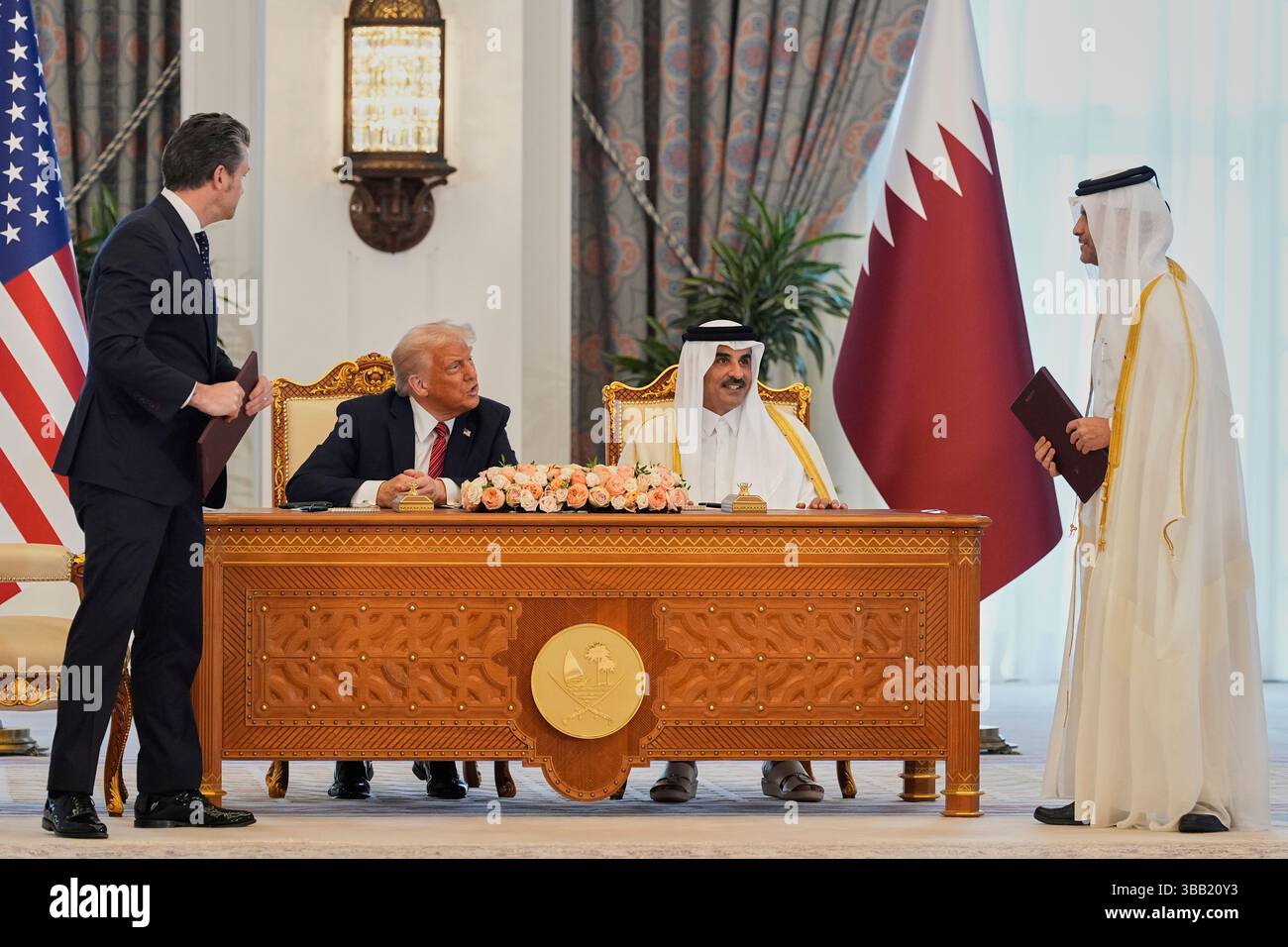 President Donald Trump and Qatar's Emir Sheikh Tamim bin Hamad Al Thani speak with Secretary of ...