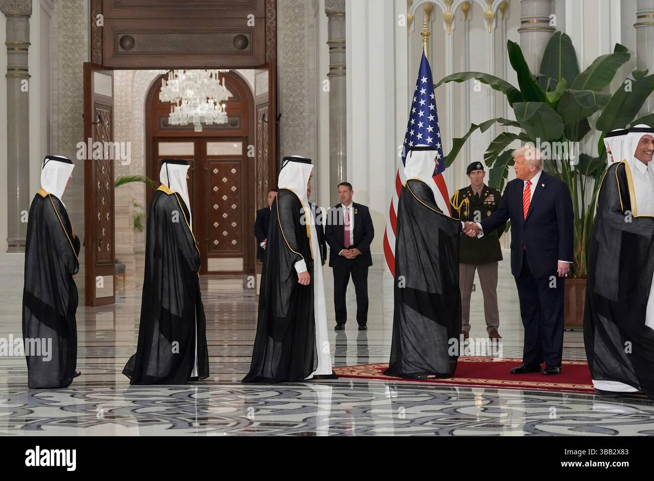 President Donald Trump greets Qatari delegations with Qatar's Emir ...