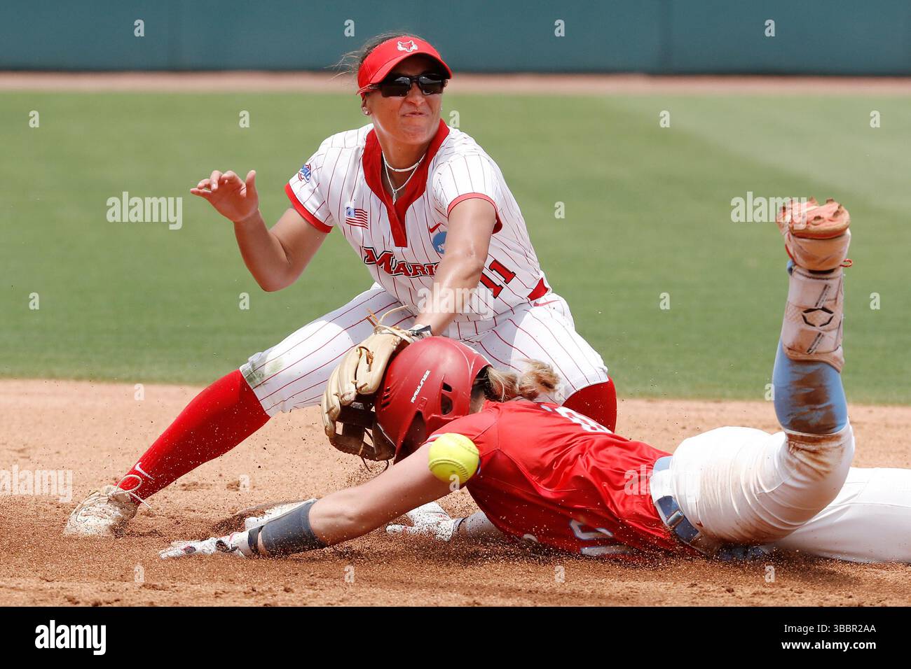 Marist shortstop Miah McDonald (11) misses the catch as Liberty's ...
