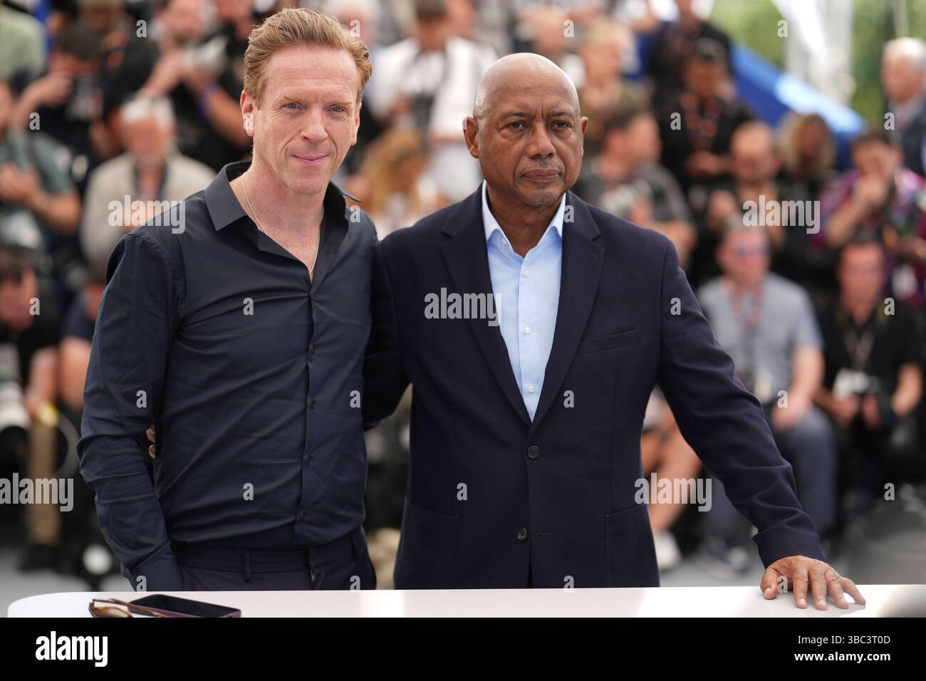 Damian Lewis, left, and director Raoul Peck pose for photographers at ...