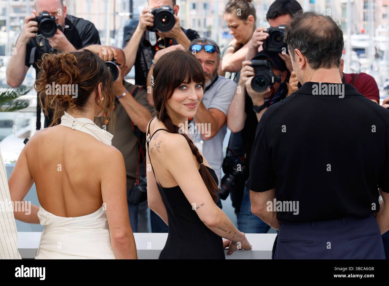 Adria Arjona, from left, Dakota Johnson and director Michael Angelo ...