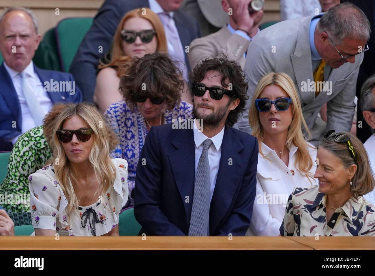 Actor Sienna Miller, her partner Oli Green and Jodie Foster, from left ...