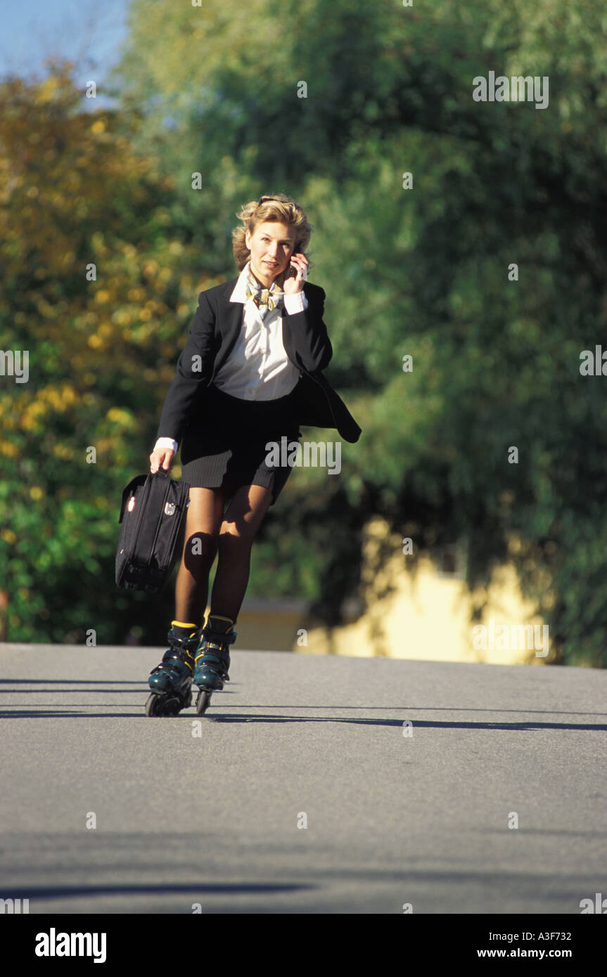 Woman roller blading work briefcase -Fotos und -Bildmaterial in hoher ...