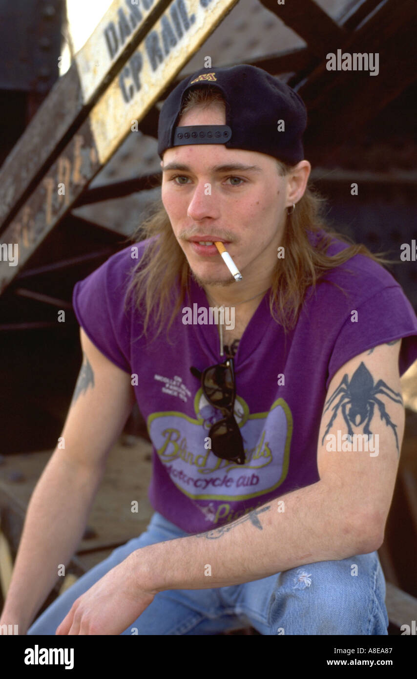 Young man smoking model released -Fotos und -Bildmaterial in hoher ...