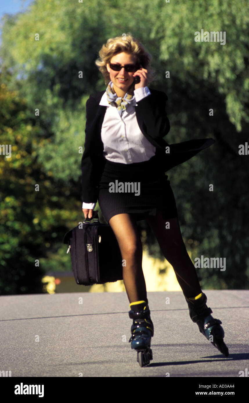 Woman roller blading work briefcase -Fotos und -Bildmaterial in hoher ...