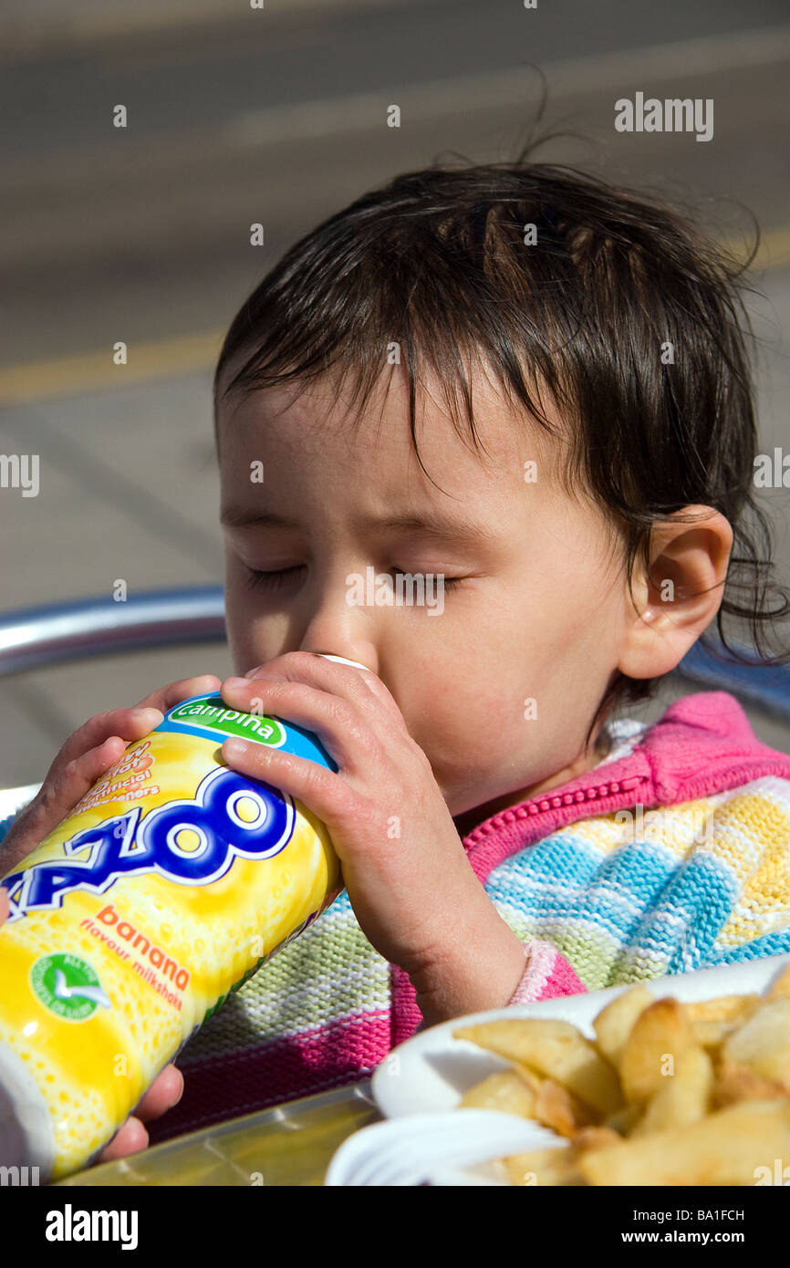 Girl drinking milk through straw -Fotos und -Bildmaterial in hoher ...