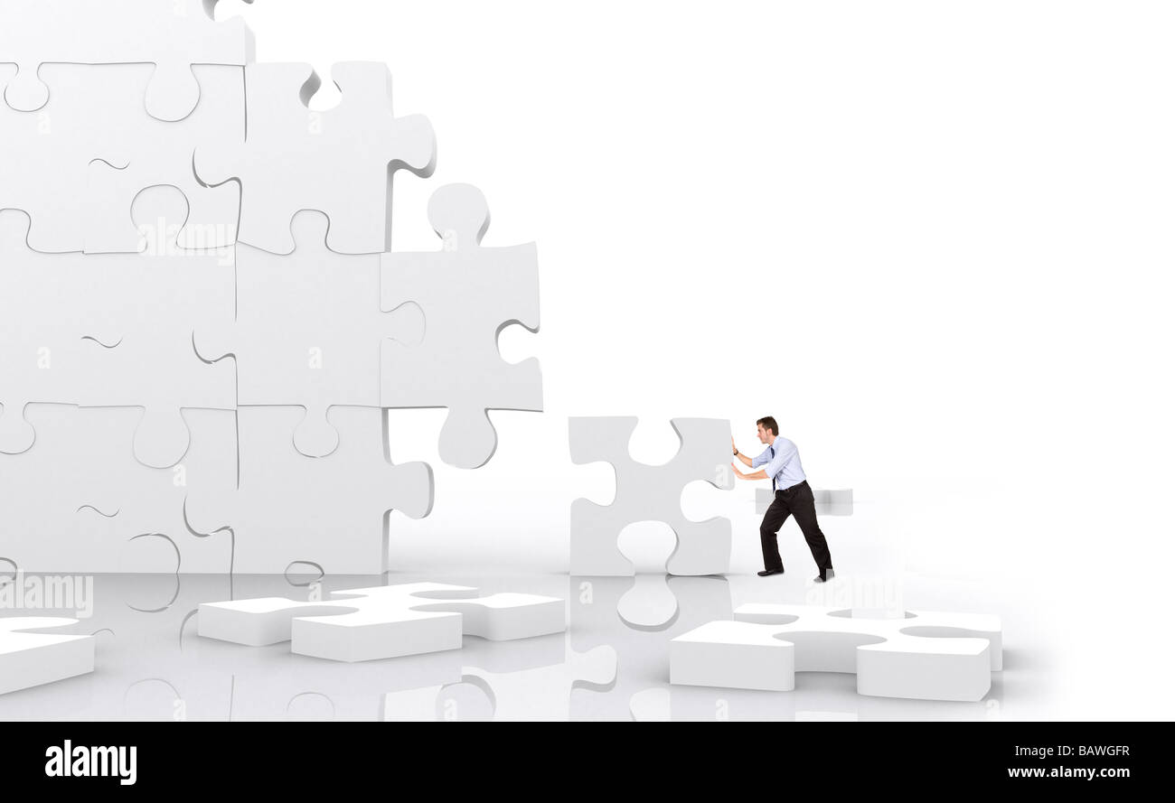 Man pushing puzzle piece -Fotos und -Bildmaterial in hoher Auflösung ...