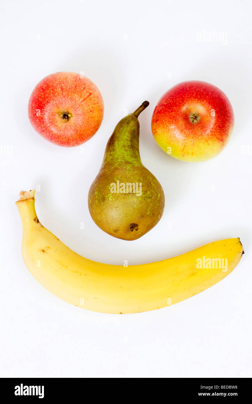 Lächelnde Gesicht von Birne, Apfel und Banane Stockfotografie - Alamy