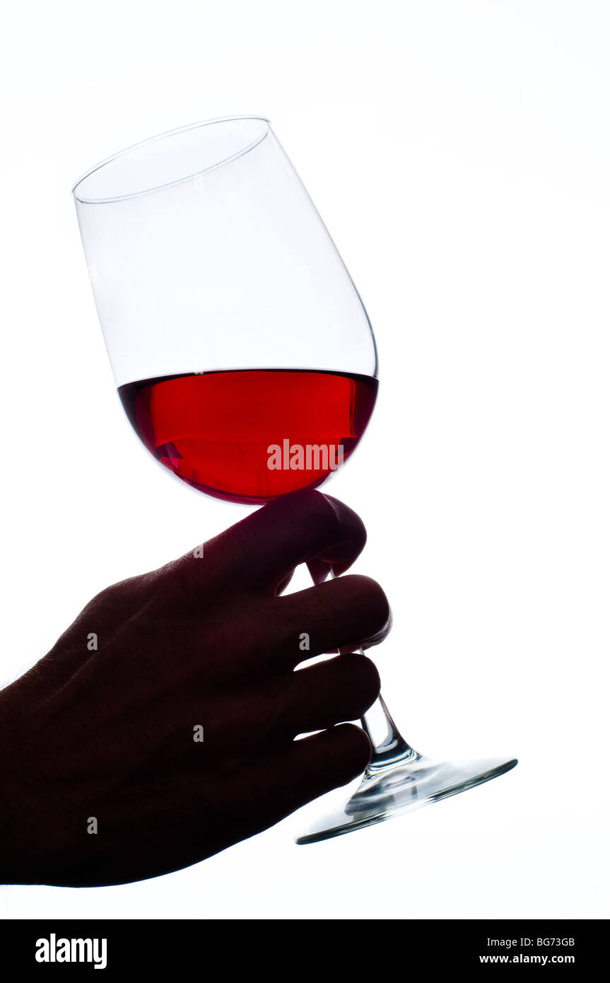 Hand holding red wine glass silhouette -Fotos und -Bildmaterial in ...