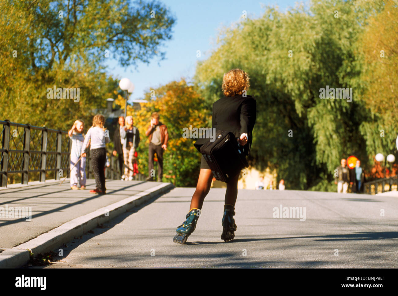 Woman roller blading work briefcase -Fotos und -Bildmaterial in hoher ...