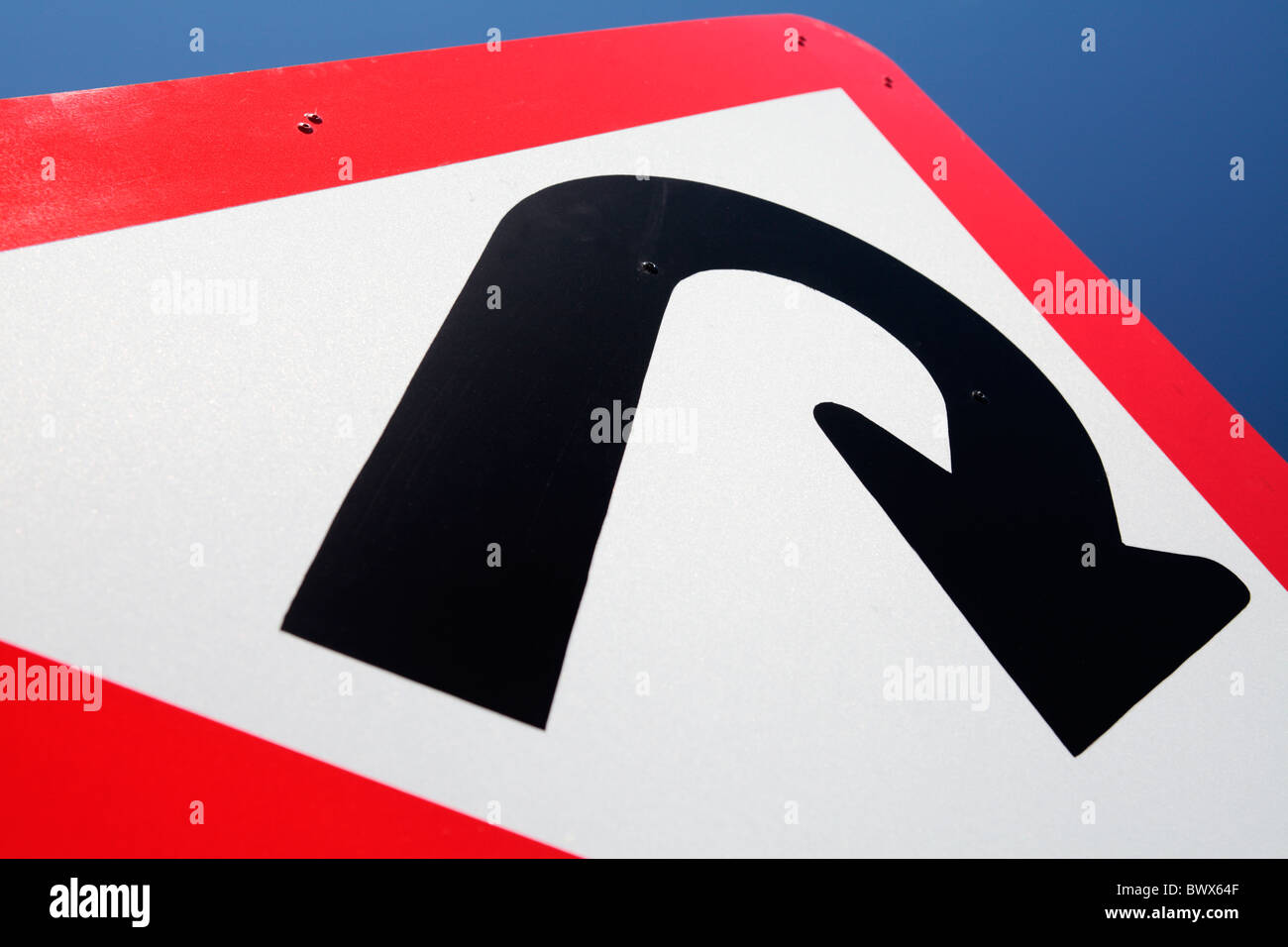 Dangerous bend warning sign -Fotos und -Bildmaterial in hoher Auflösung ...