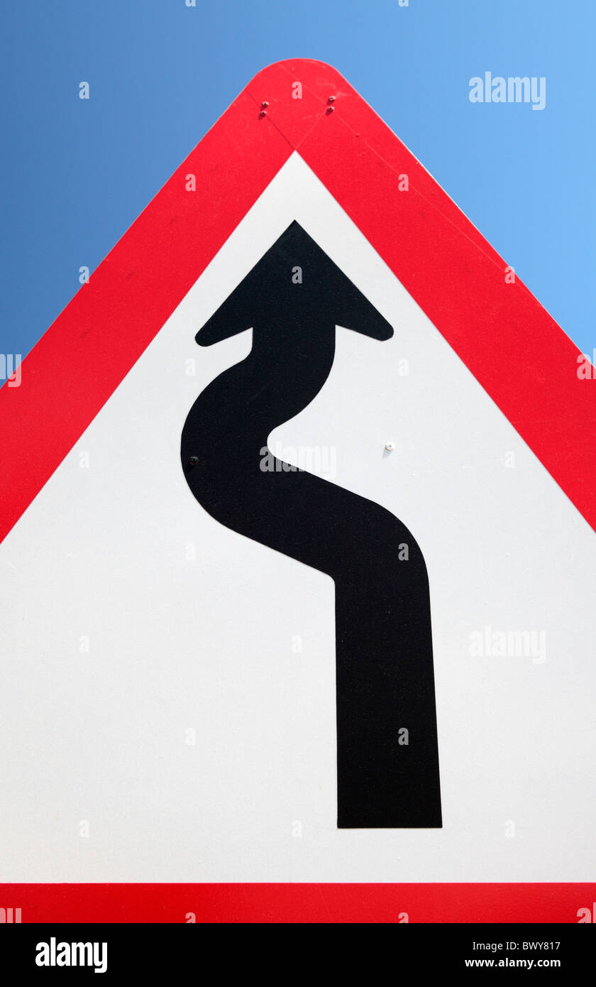 Dangerous bend warning sign -Fotos und -Bildmaterial in hoher Auflösung ...
