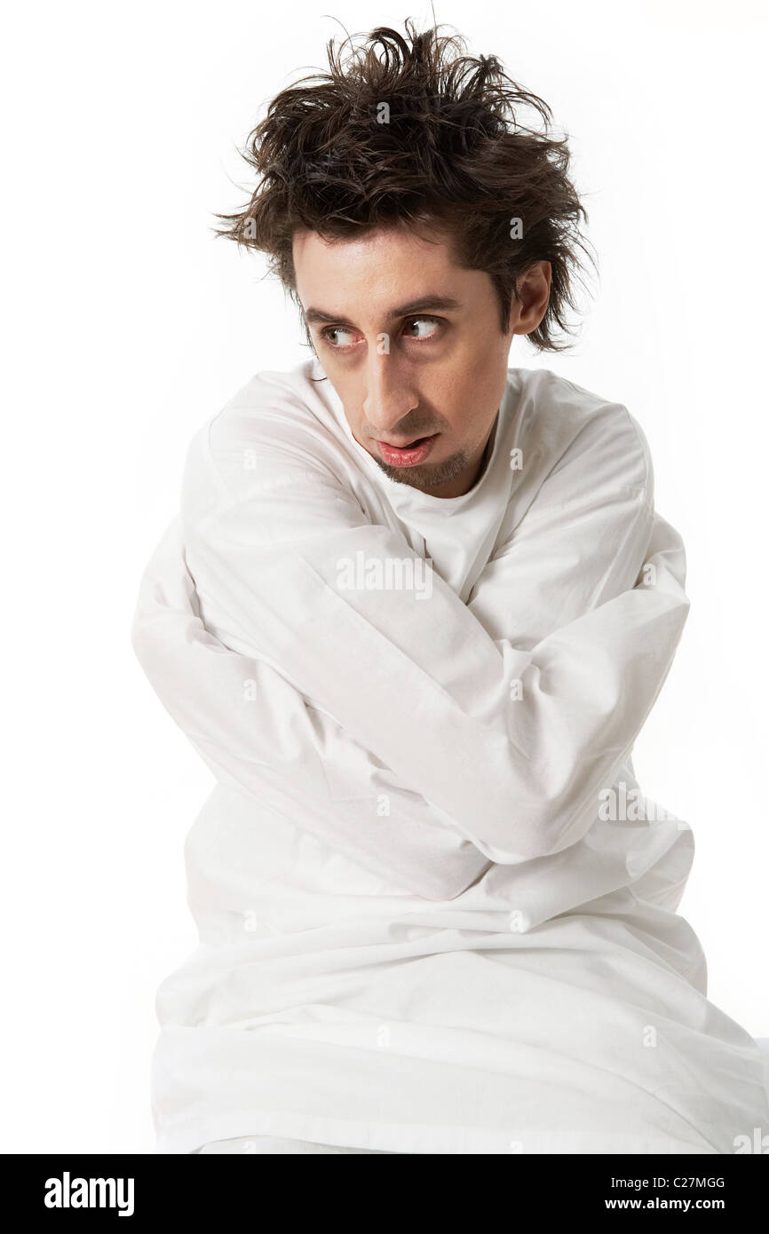 Porträt von psychisch kranken Mann mit Zwangsjacke isoliert ...
