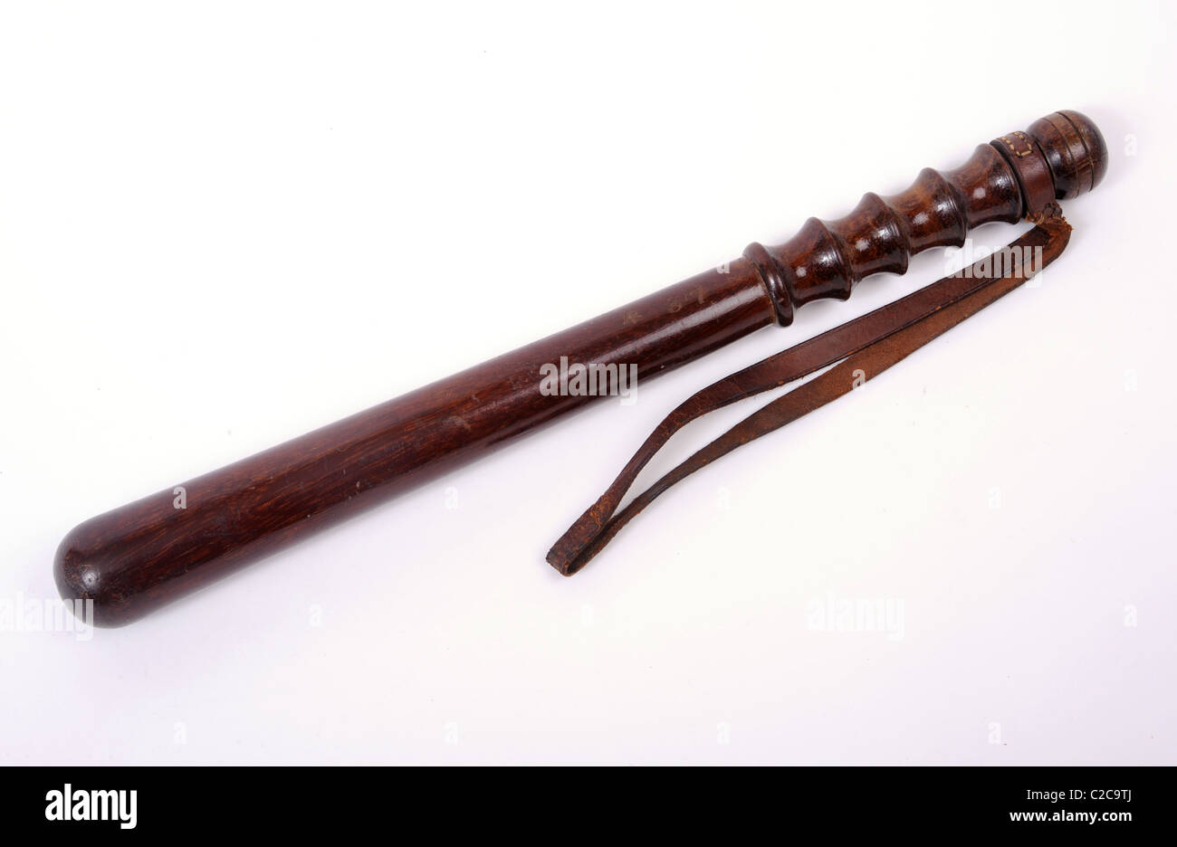 Eine alte drehte Holz Polizei Schlagstock mit Leder-Armband ...