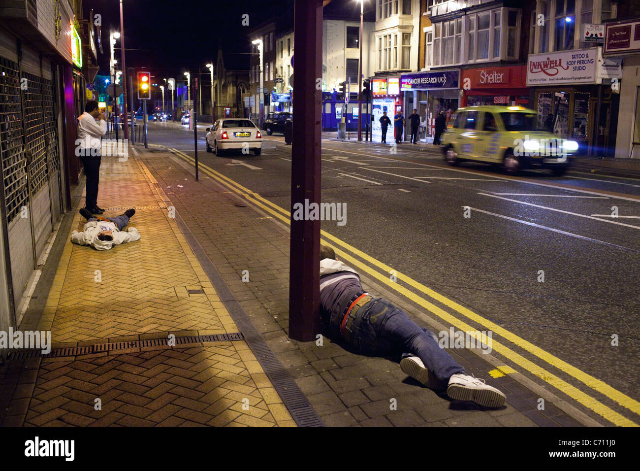 Drunk person lying street -Fotos und -Bildmaterial in hoher Auflösung ...
